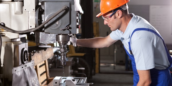 Worker running drill - Mize CPAs Inc.